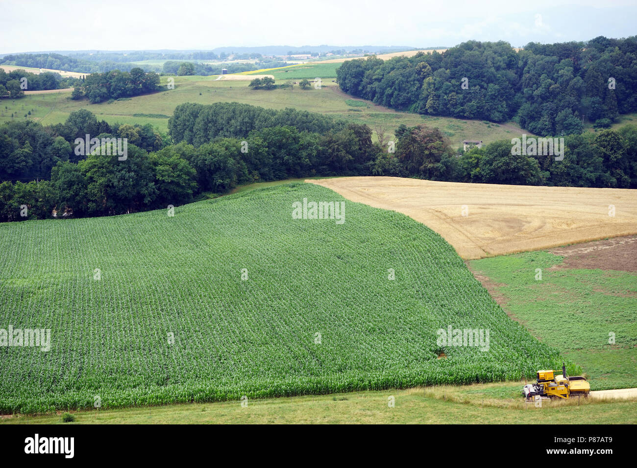 Green field and tractor in Switzerland Stock Photo - Alamy