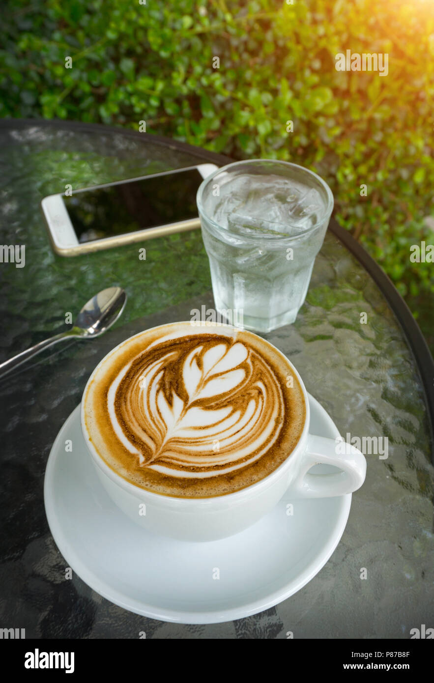 Cup of latte art Coffee in coffee shop. Latte art Coffee is the type of ...