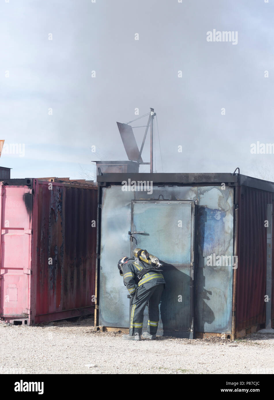 Firefighter putting out fire training station extinguisher backdraft ...