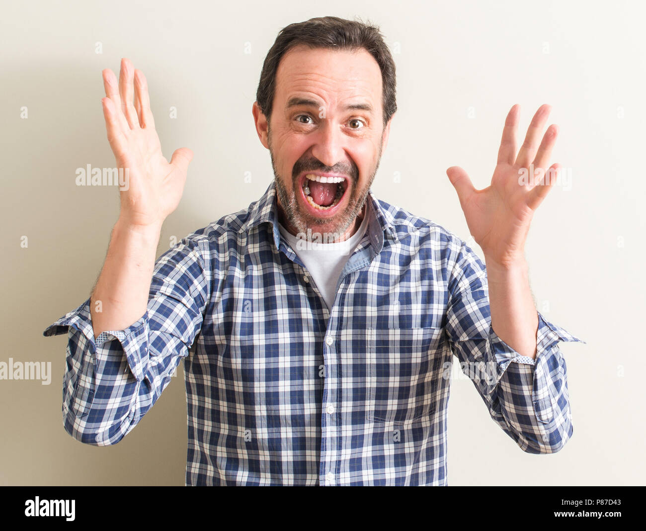 Senior man very happy and excited, winner expression celebrating ...