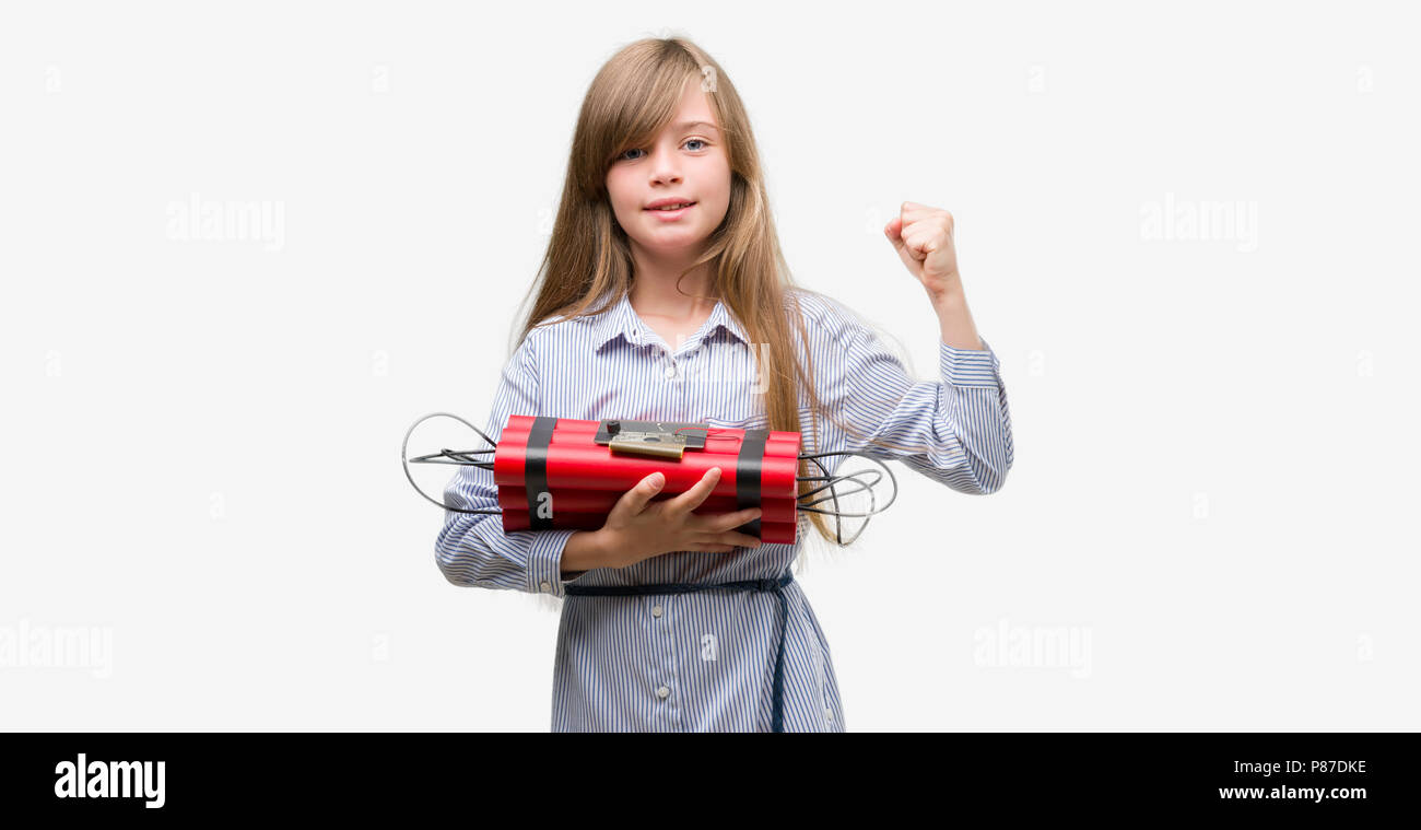 Young blonde child holding dynamite bomb screaming proud and ...