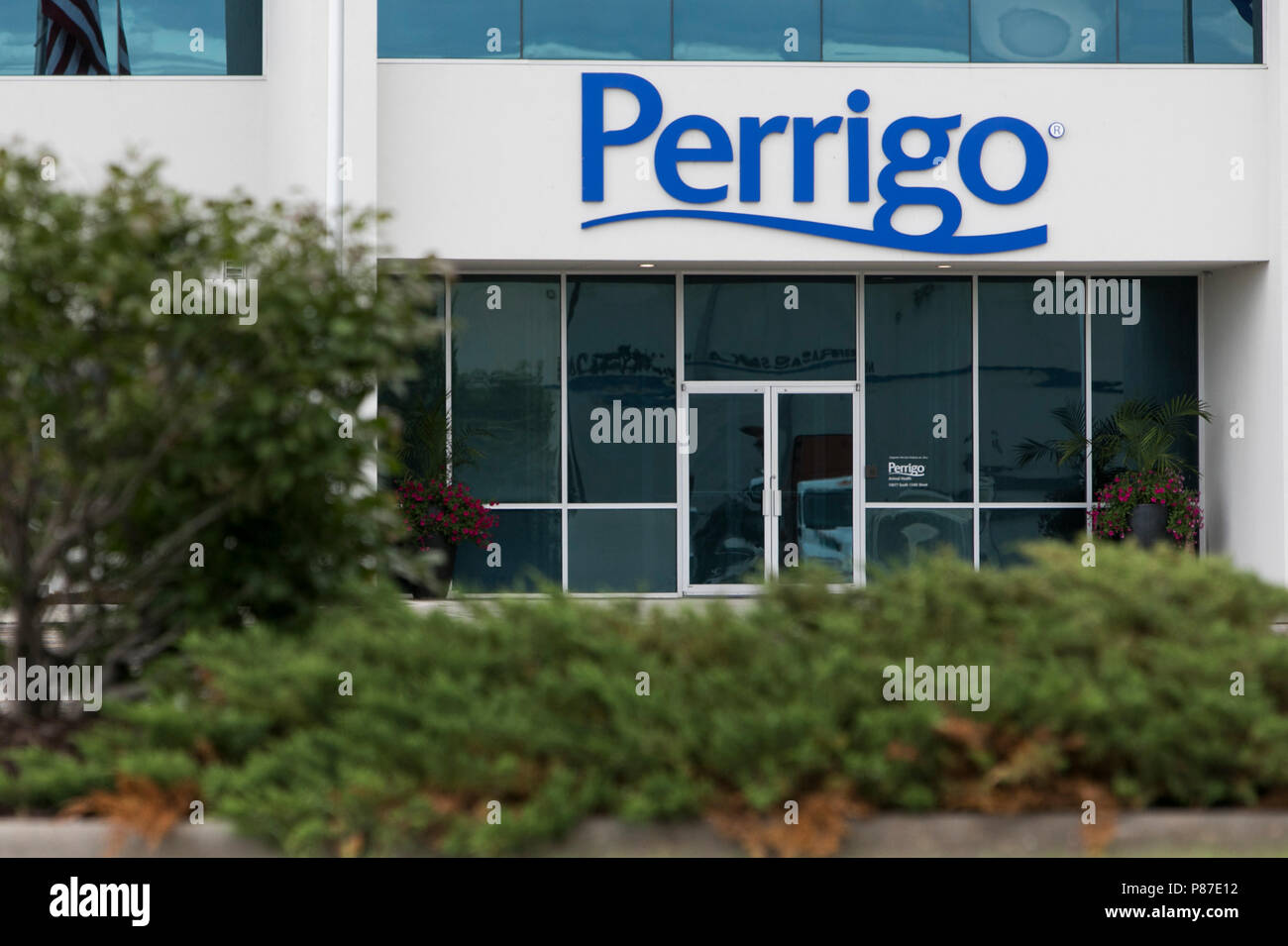 A logo sign outside of a facility occupied by the Perrigo Company in ...