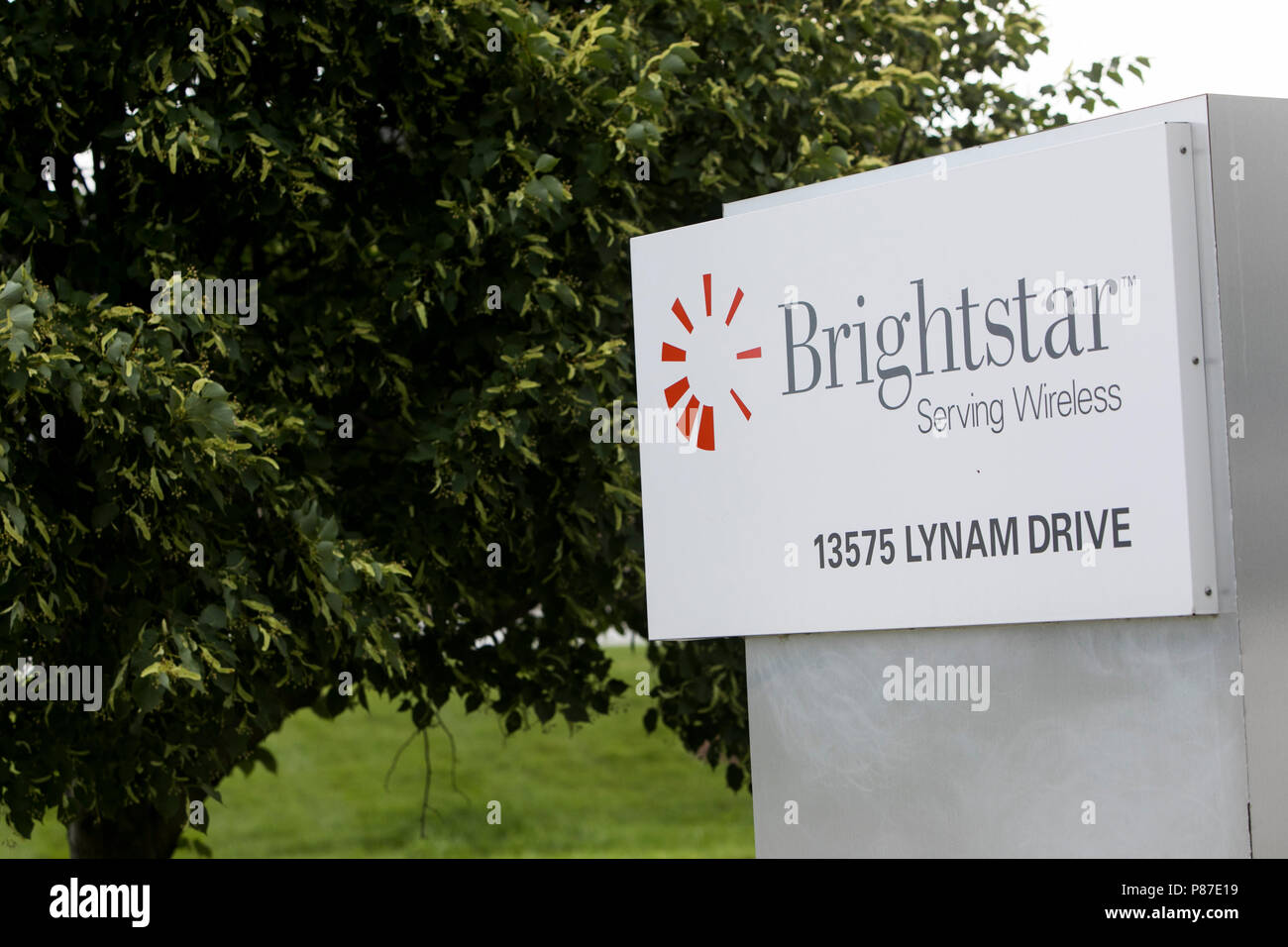 A logo sign outside of a facility occupied by the Brightstar ...