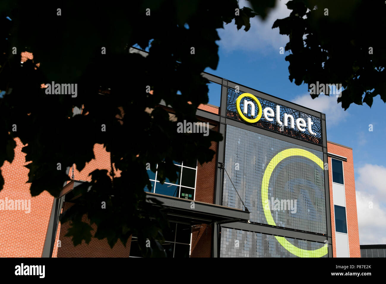 A logo sign outside of a facility occupied by Nelnet in Lincoln ...