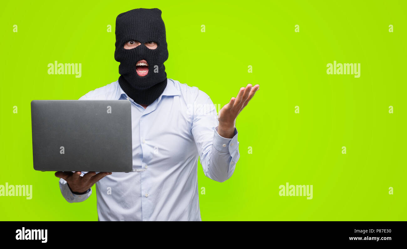 Handsome man cheering with a laptop hi-res stock photography and images ...