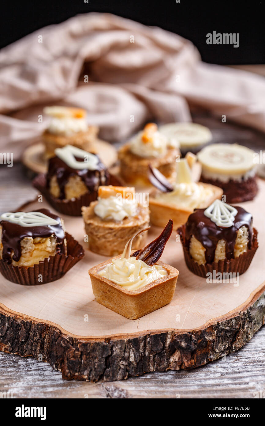 Different sort of beautiful pastry, small sweet cakes Stock Photo - Alamy