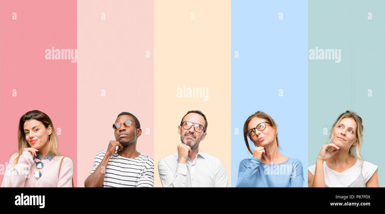 Mixed group of people, women and men thinking and looking up expressing ...