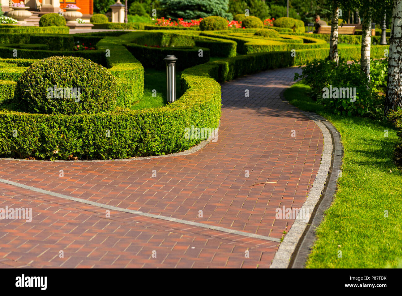 A path of tiles in a landscape design Stock Photo - Alamy