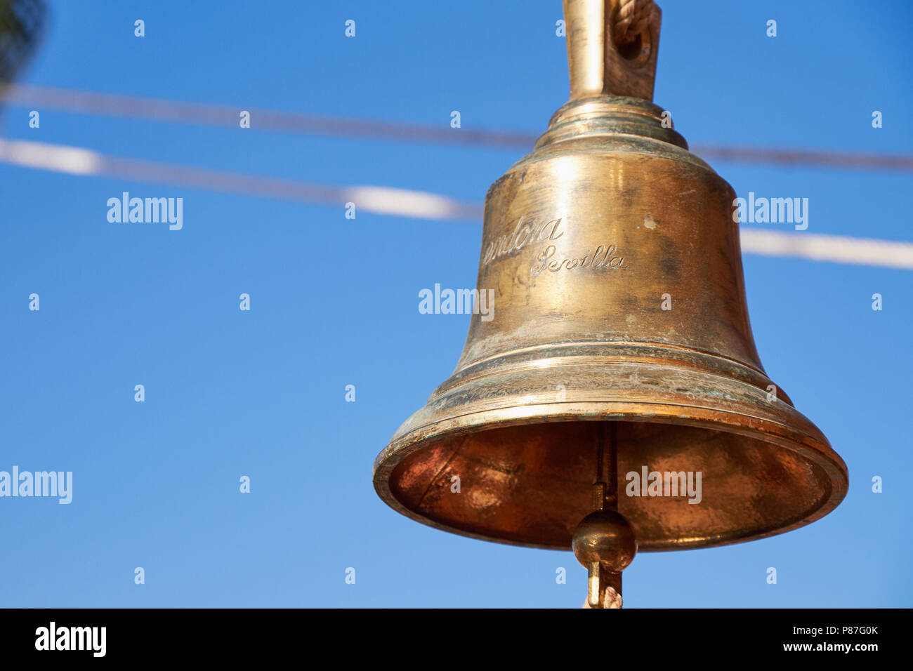 Marine background, sailing boat bell with blue sky Stock Photo - Alamy