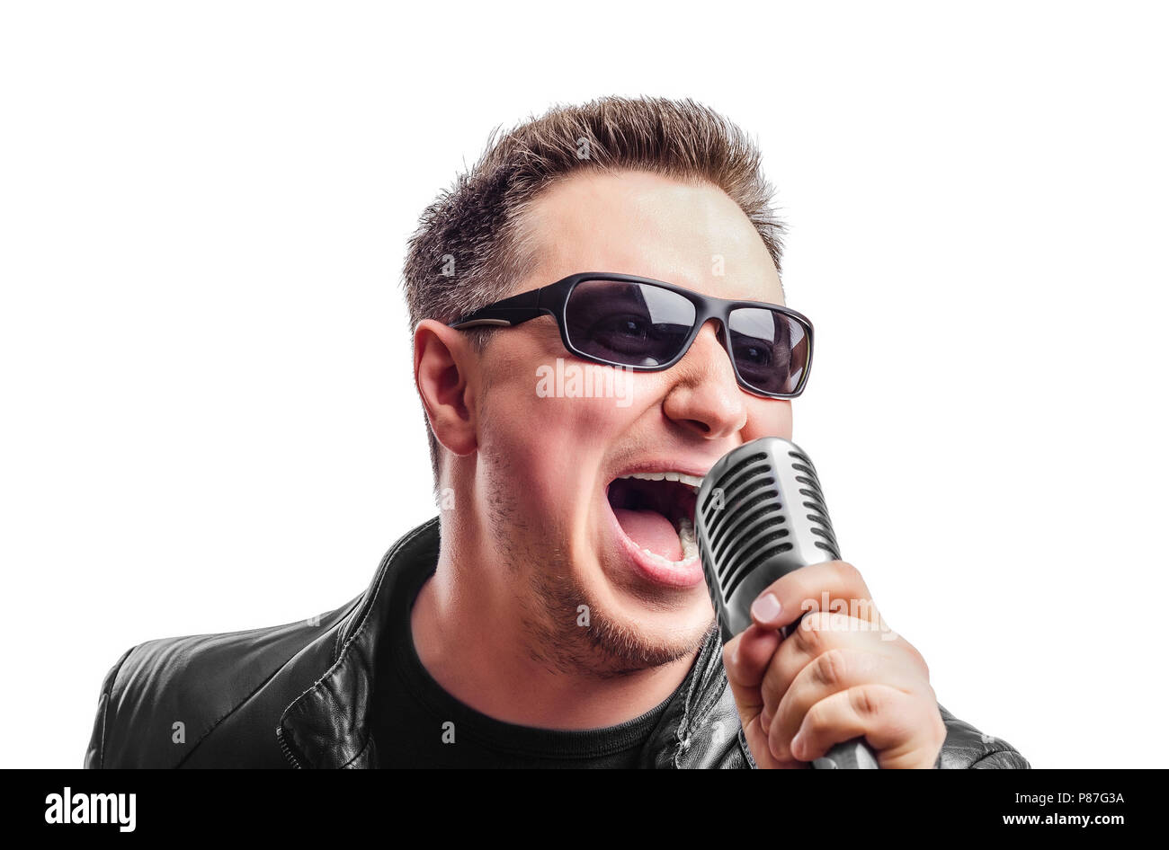 Rock singer with a microphone sings emotionally Stock Photo - Alamy