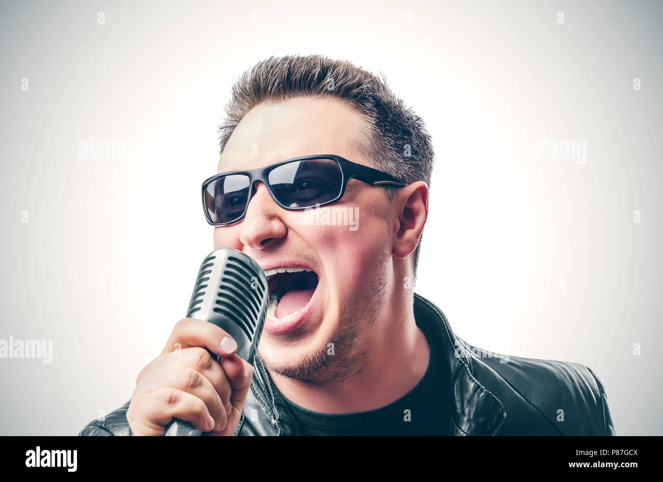 Man white beard microphone sings hi-res stock photography and images ...