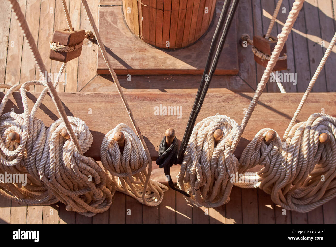 Marine background, sailing boat block with old rope Stock Photo - Alamy