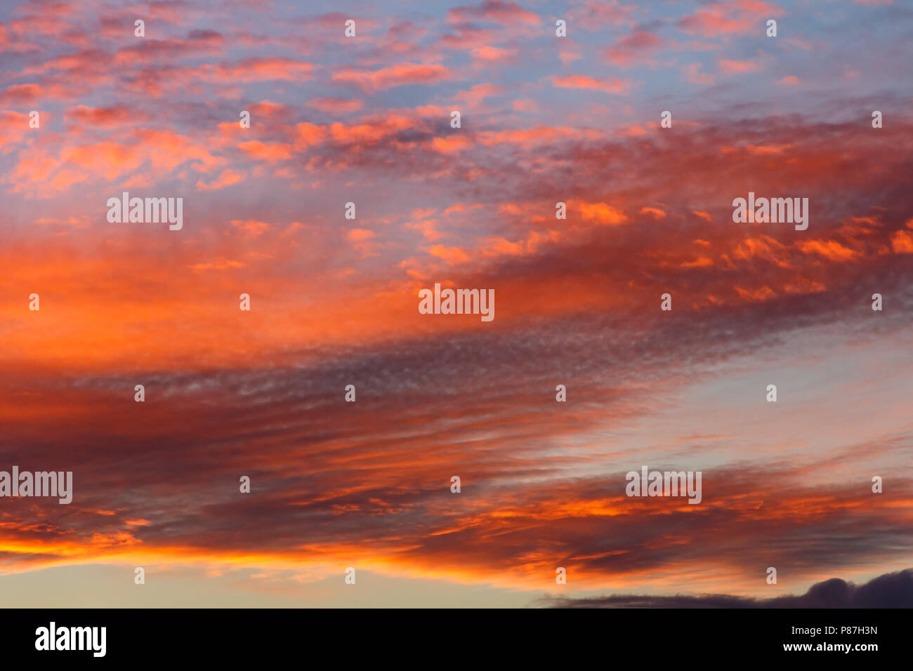 The sunset lighting up the cloud-cover Stock Photo - Alamy