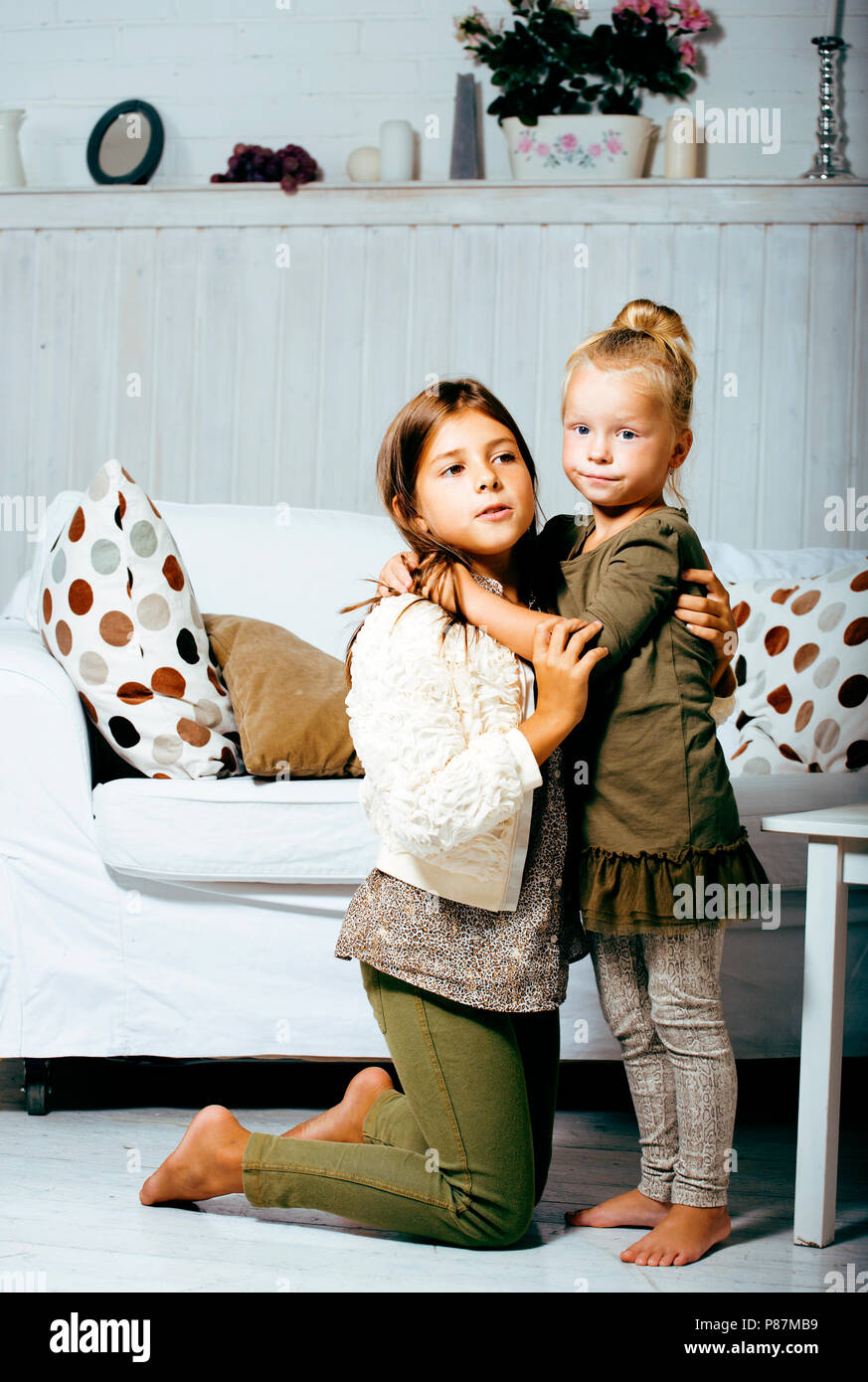 little cute boy and girl hugging playing on white background, ha Stock Photo - Alamy