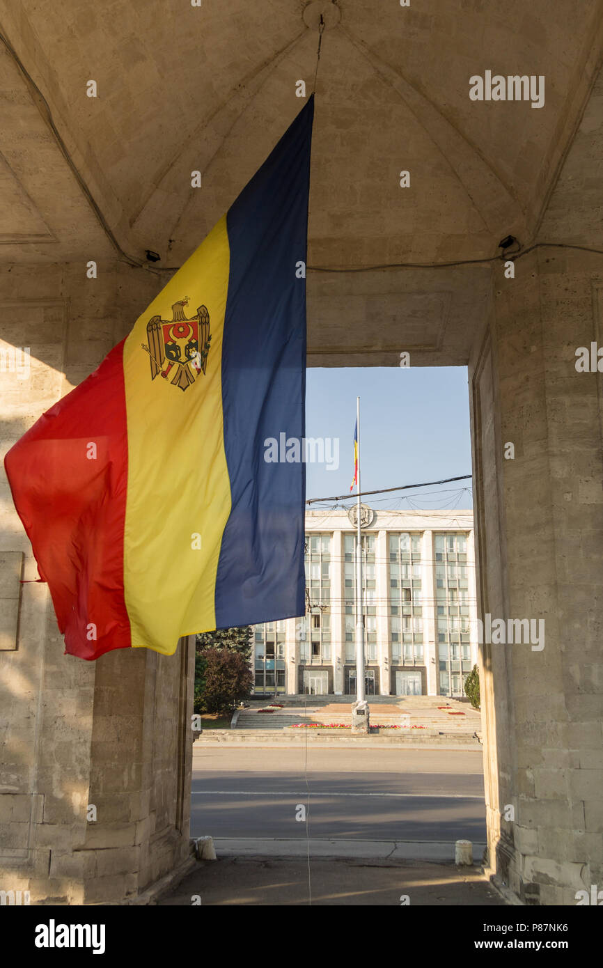 Flag of Moldova waiving under the Triumphal Arch (Arcul de Triumf) in ...