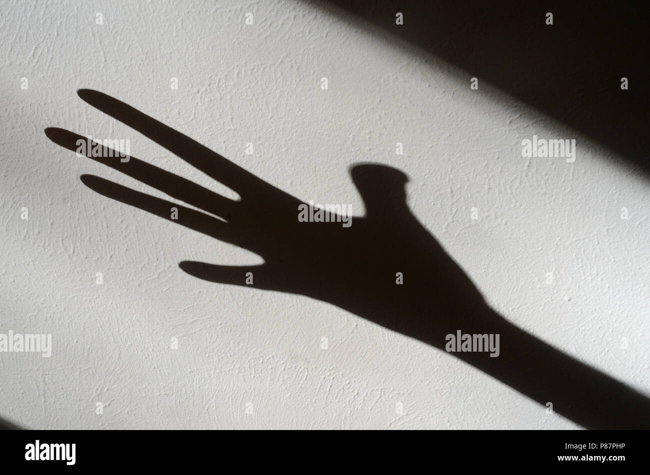 Hand making shadow hi-res stock photography and images - Alamy