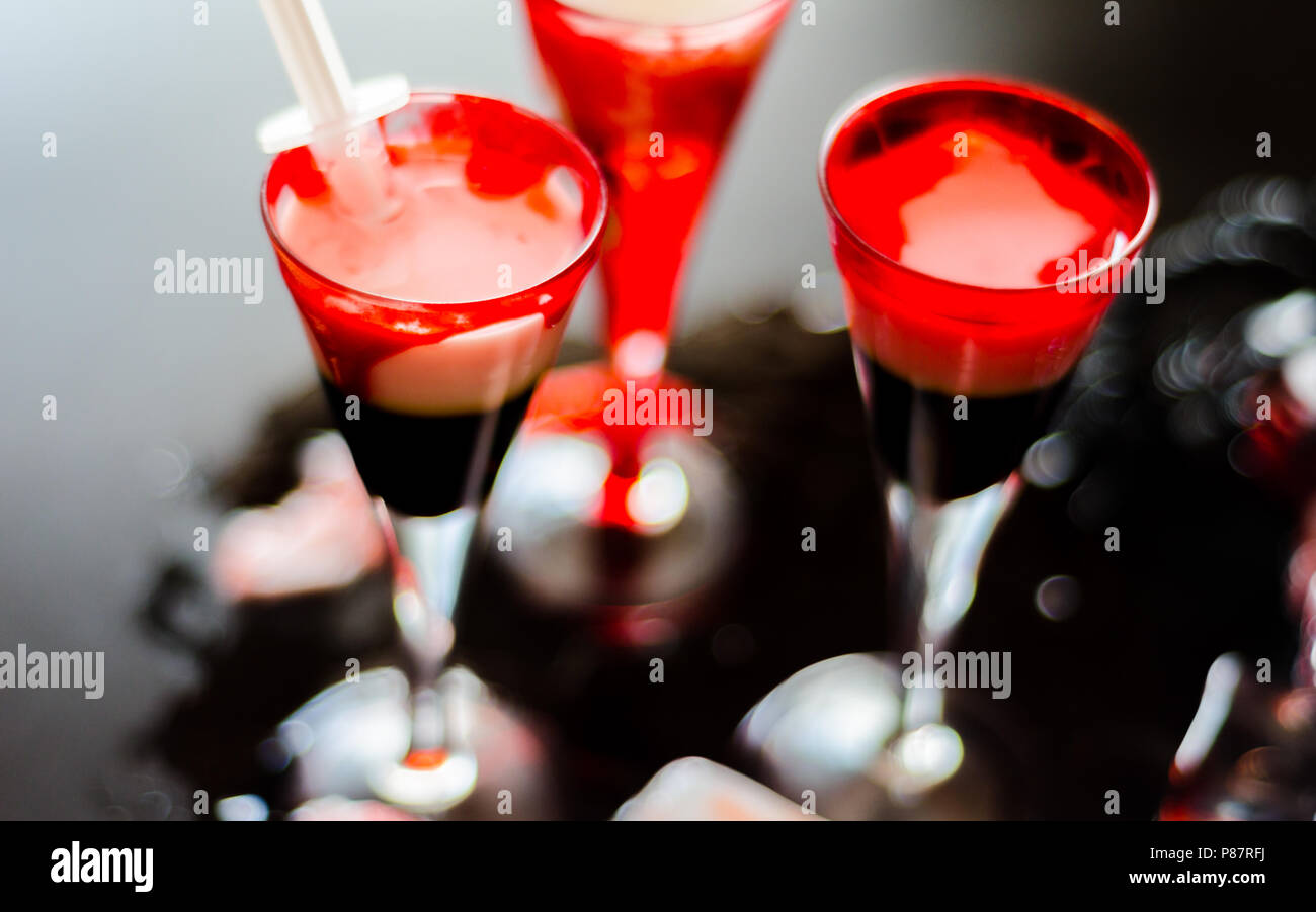 creepy halloween party cocktails with blood, spiders and ice cubes ...