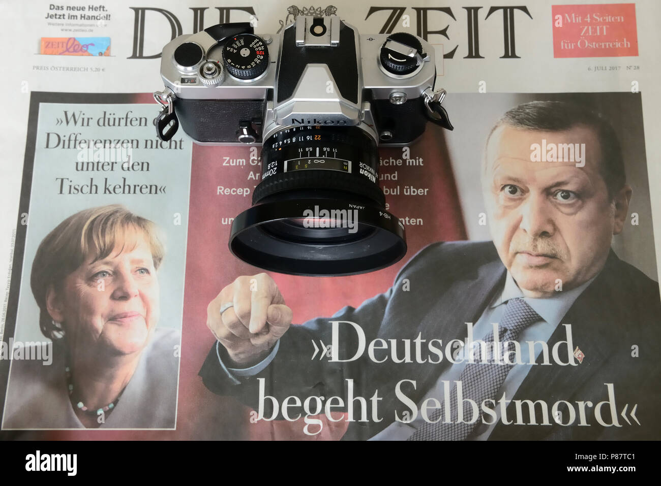 Analog camera on newspaper. In the picture Nikon FM with 20 mm lens ...