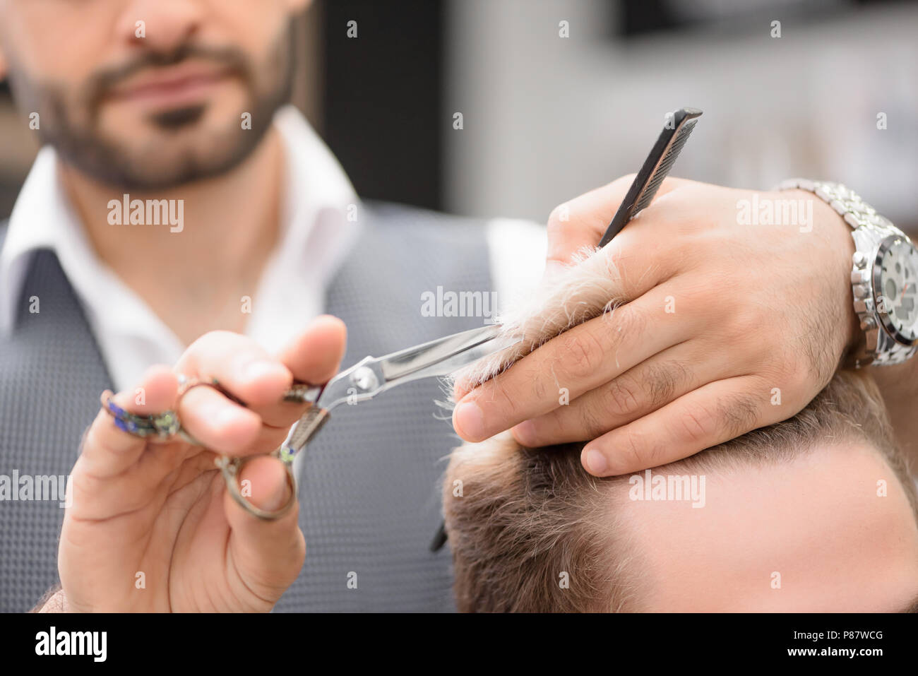 Photo of barber working with client in barbershop. Making professional ...