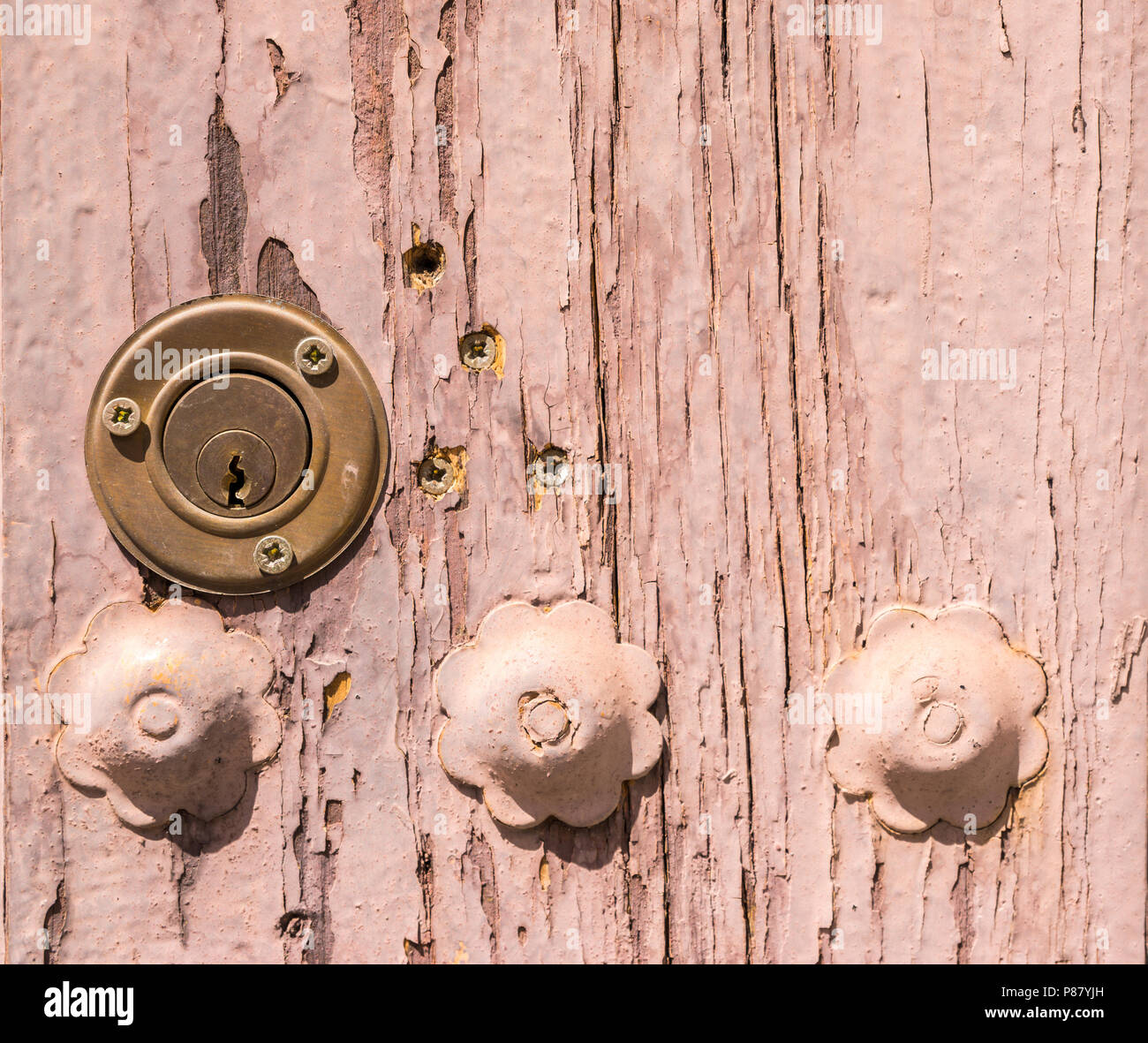 close up on the old lock with an interesting texture on the door, home ...