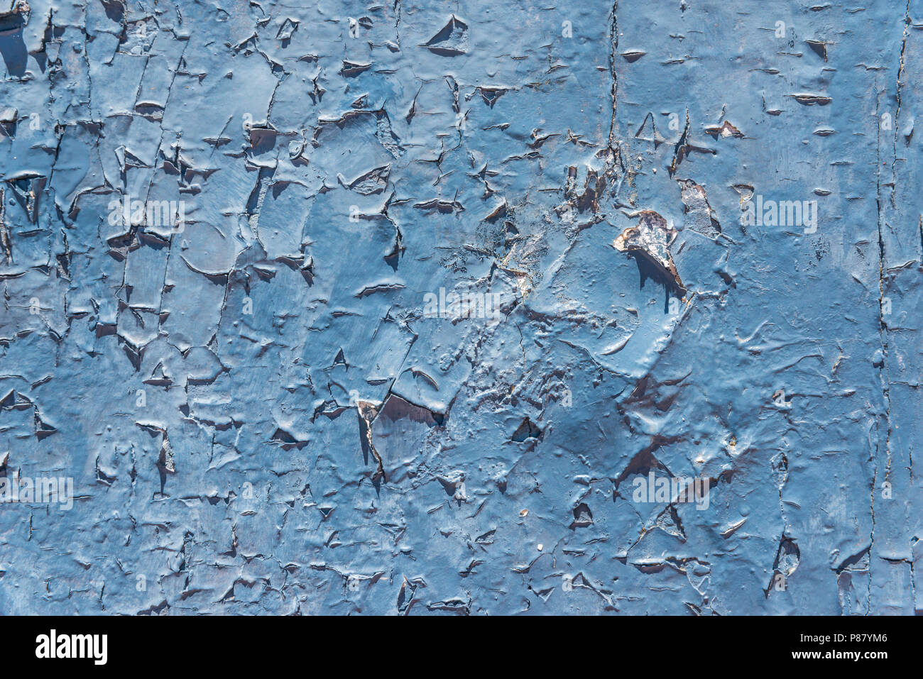 Old flaky paint peeling off on old wall, cracks and scrapes on the ...