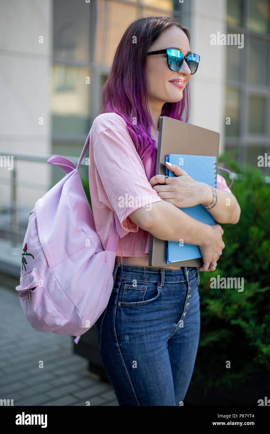 Portrait beautiful female writer dressed in casual outfit holding ...