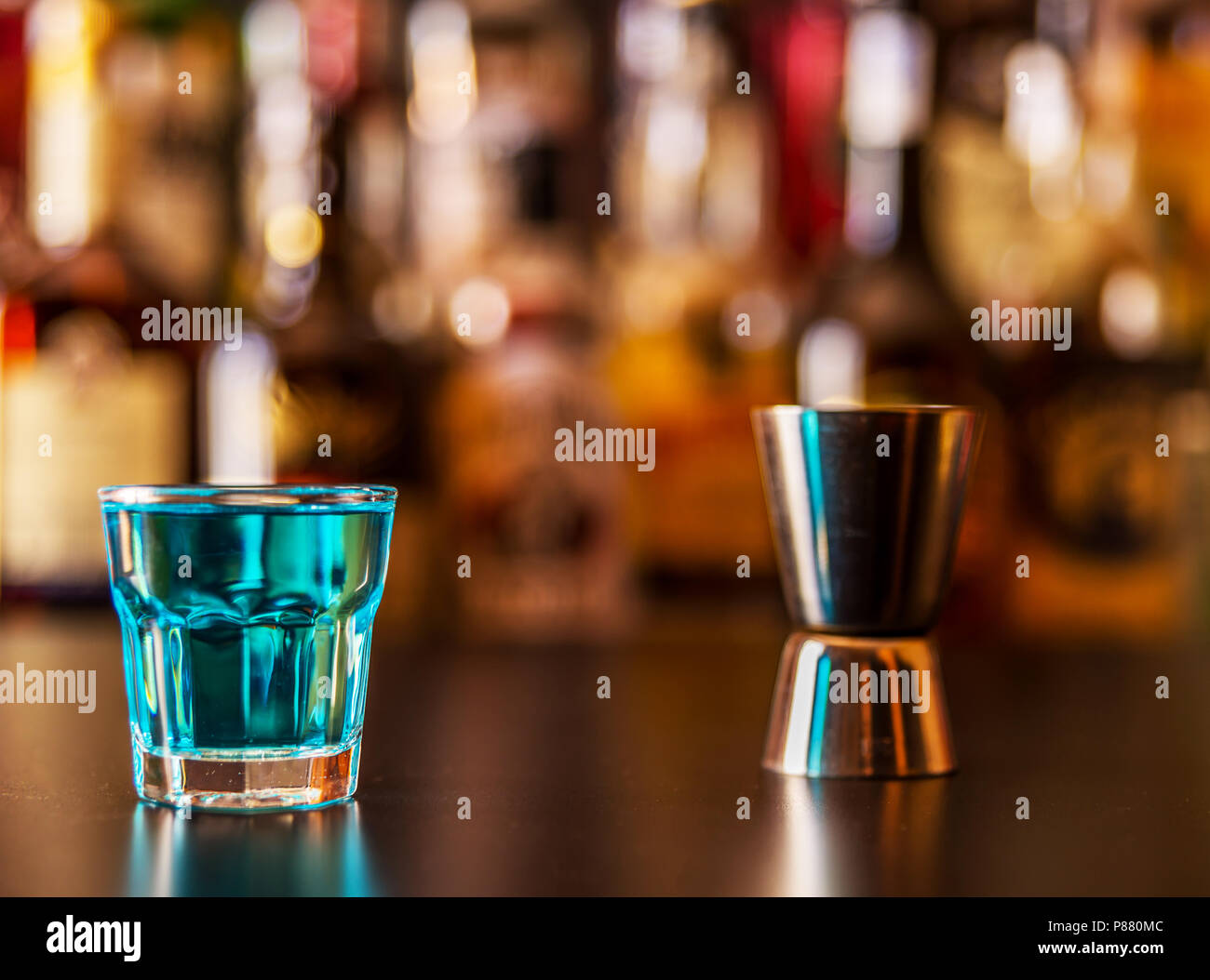 Popular blue drink shot kamikaze on the background of the bar with ...