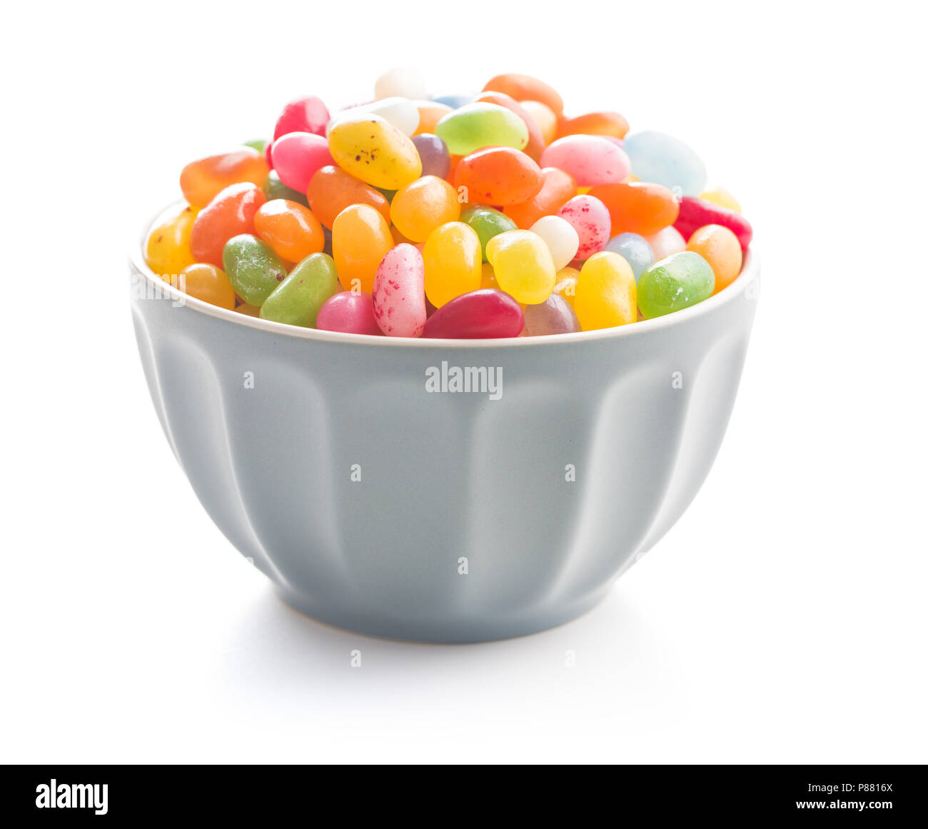 Sweet jelly beans in bowl isolated on white background Stock Photo - Alamy