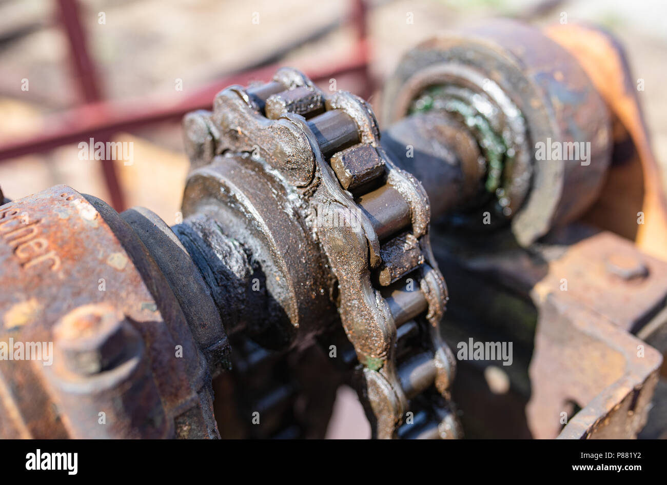 Rusty machine, old oiled chain on a ratchet. Still working technology ...