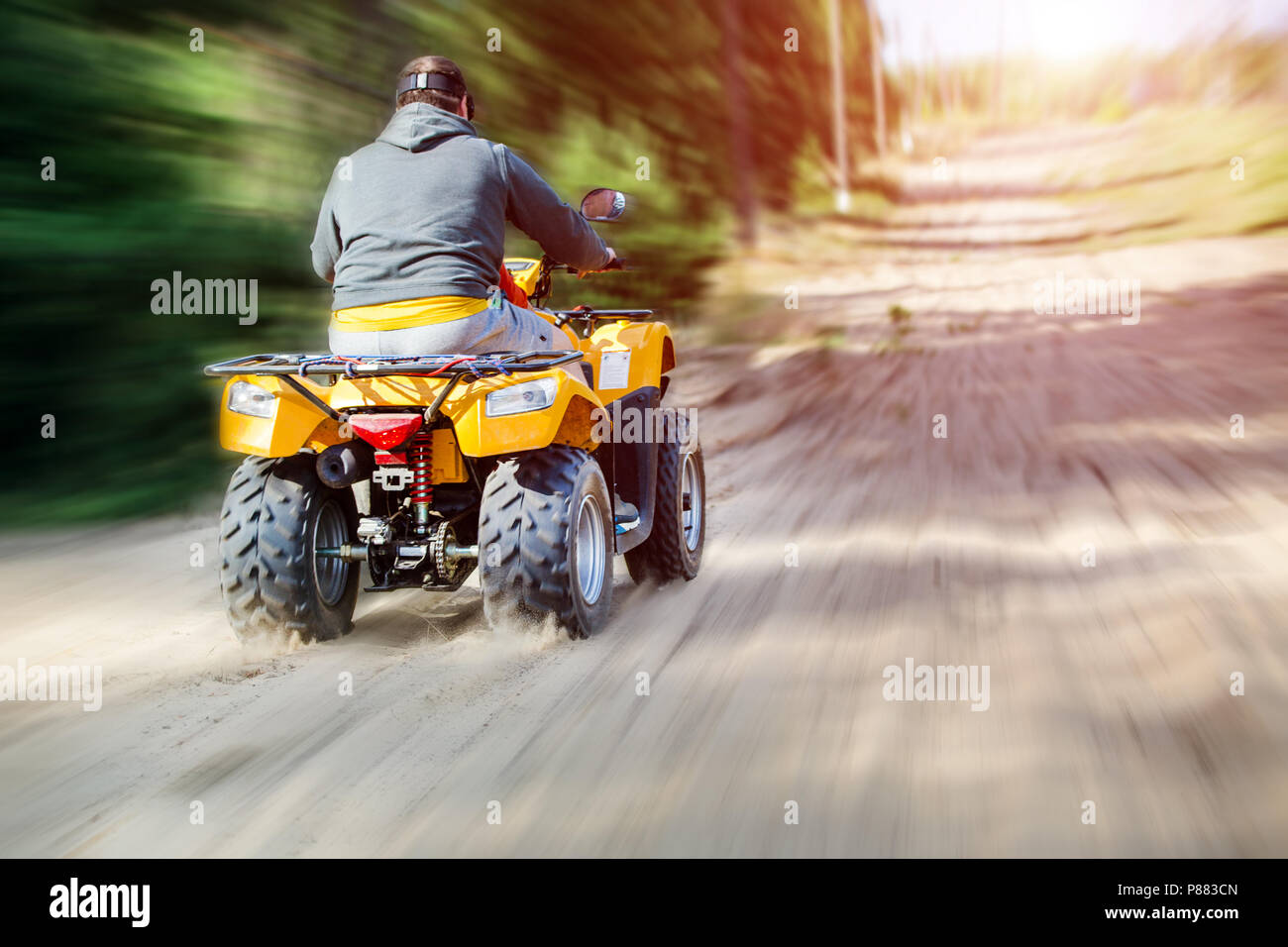 Young man riding a quad bike hi-res stock photography and images - Alamy