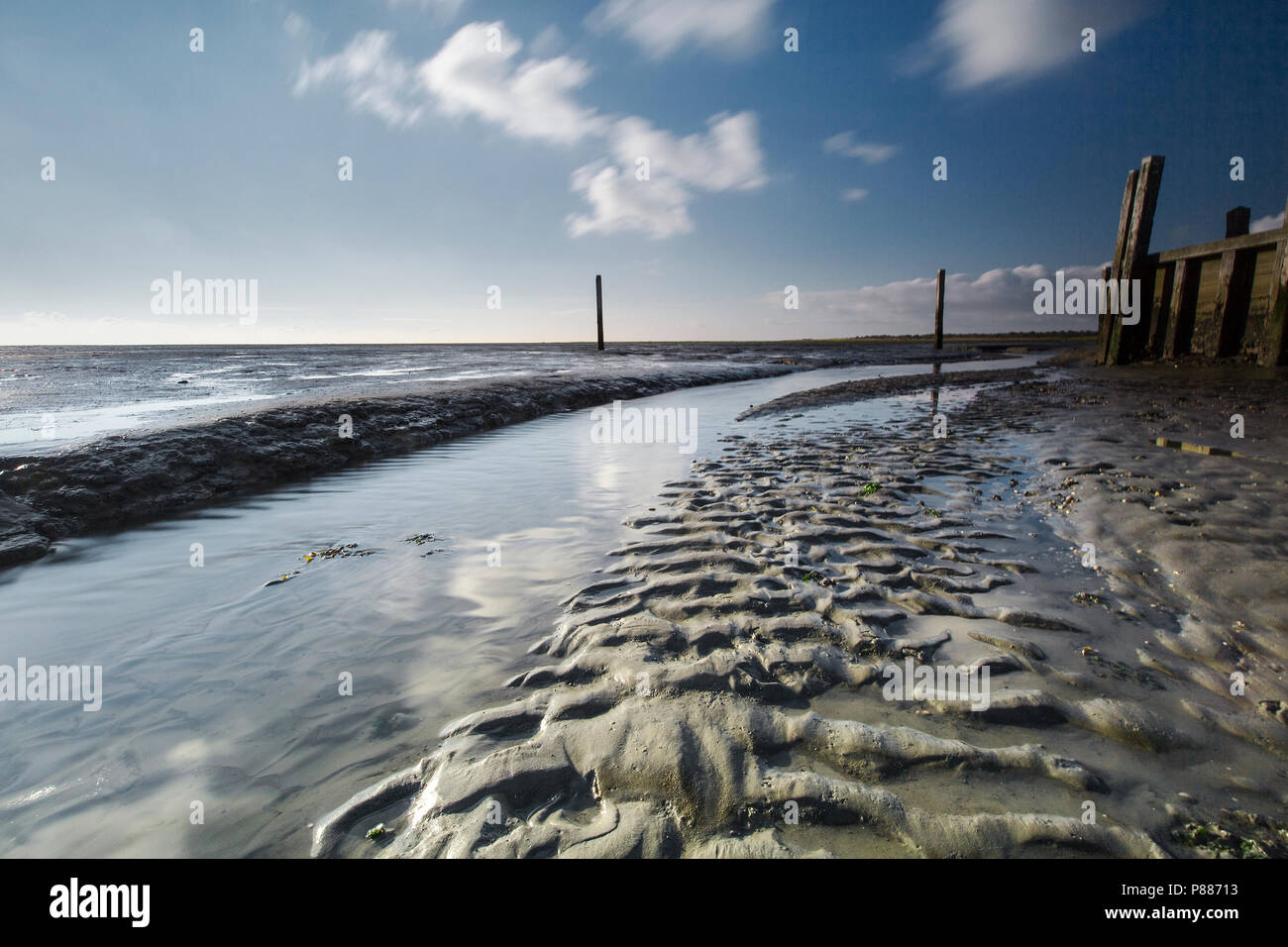 Laag water bij Schiermonnikoog, low tide Schiermonnikoog Stock Photo ...