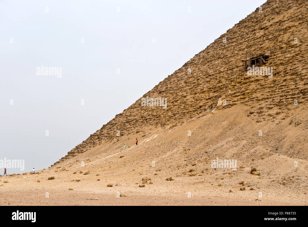 Tourists enter the Red Pyramid, named for its red limestone, at Dahshur ...