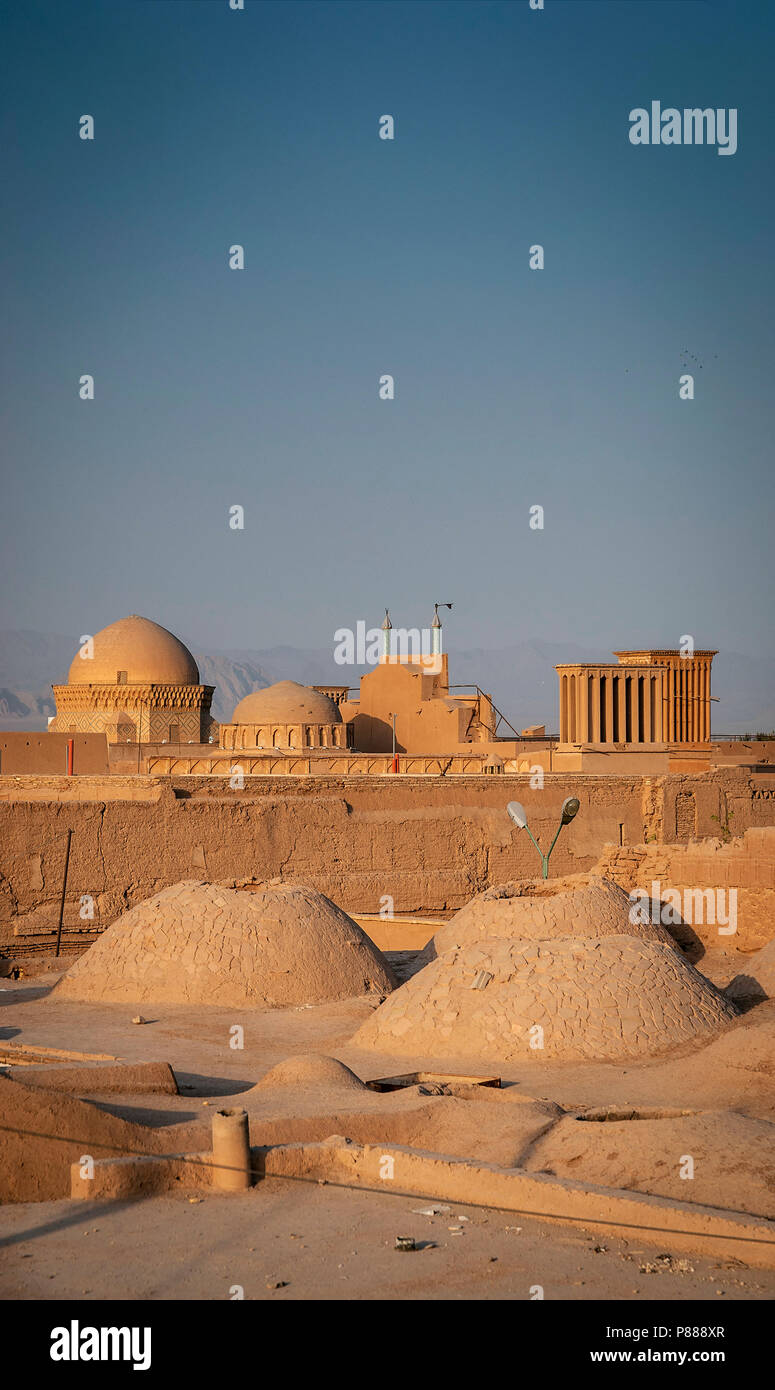downtown rooftops wind towers and landscape view of yazd city old town ...
