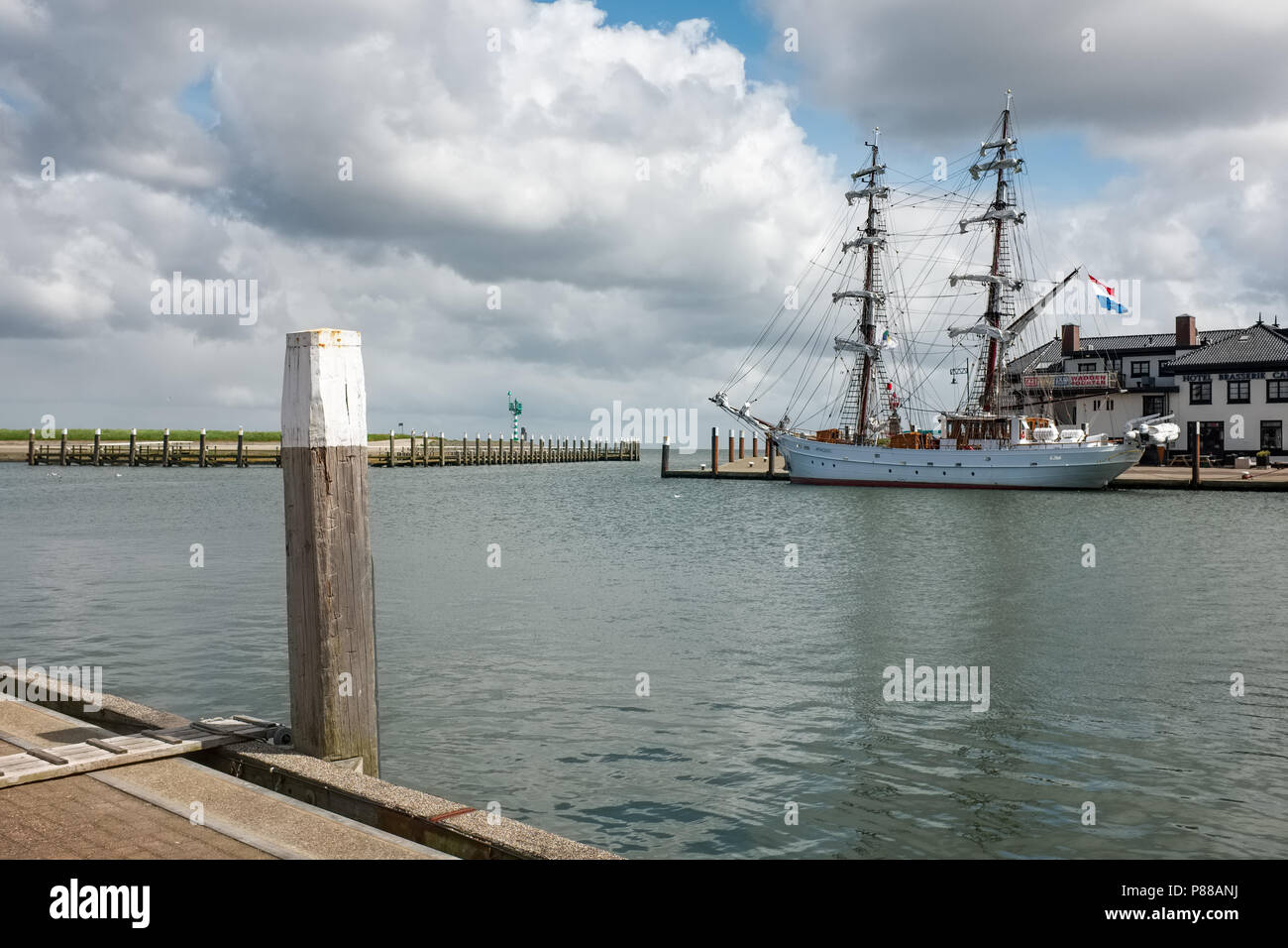 Sailing ship Aphrodite harboured in the old fishing port of Oudeschild ...