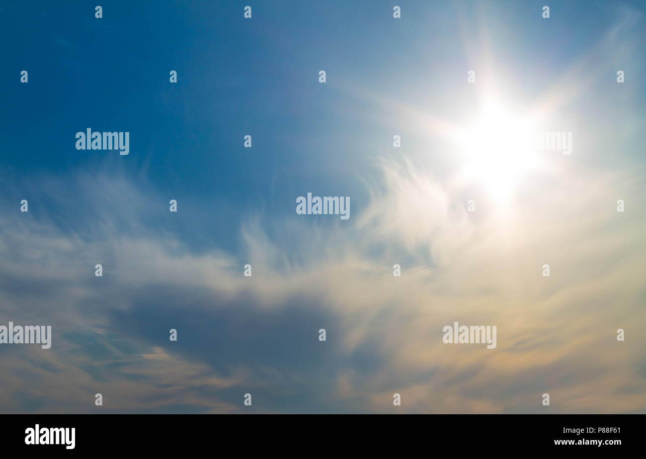 Sun in blue sky hi-res stock photography and images - Alamy