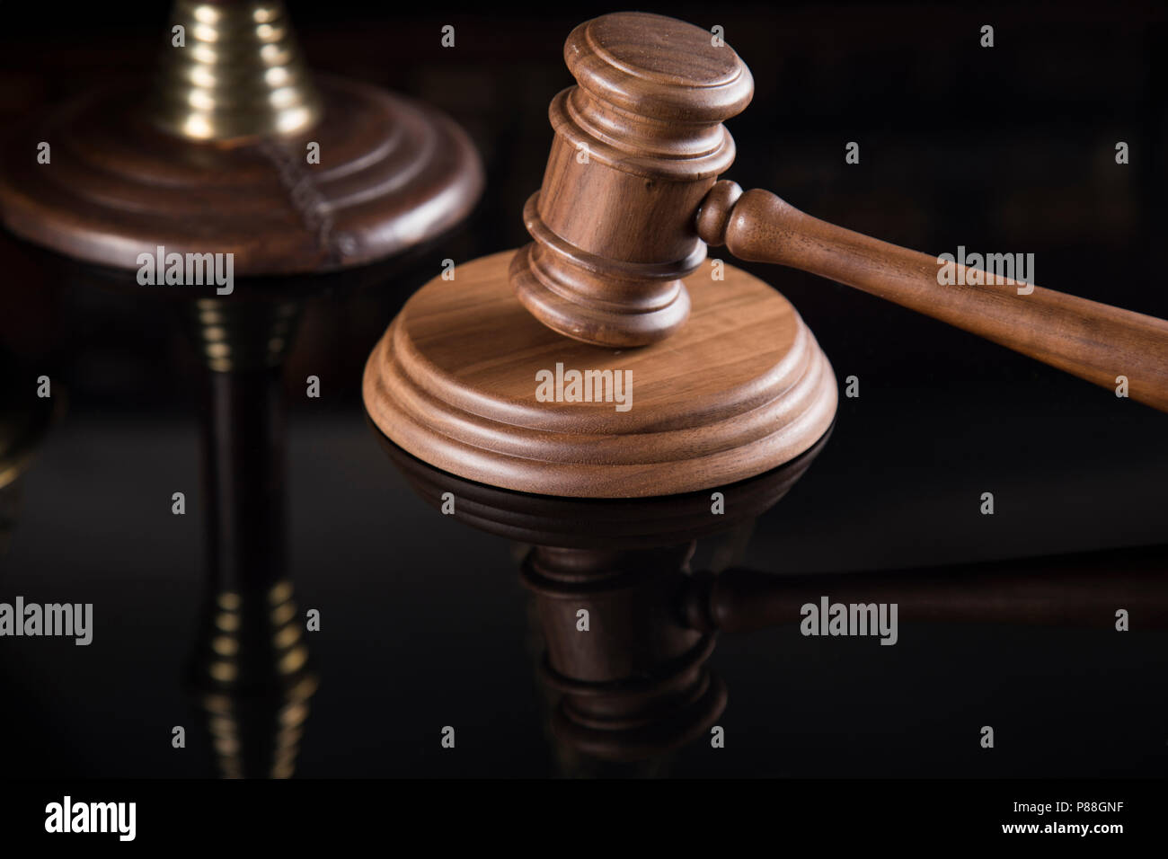 Law theme, mallet of judge, wooden gavel, mirror reflection background ...