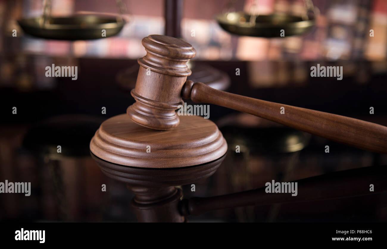 Law theme, mallet of judge, wooden gavel, mirror reflection background ...