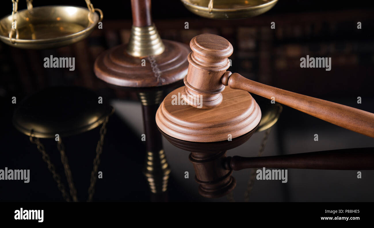 Law theme, mallet of judge, wooden gavel, mirror reflection background ...