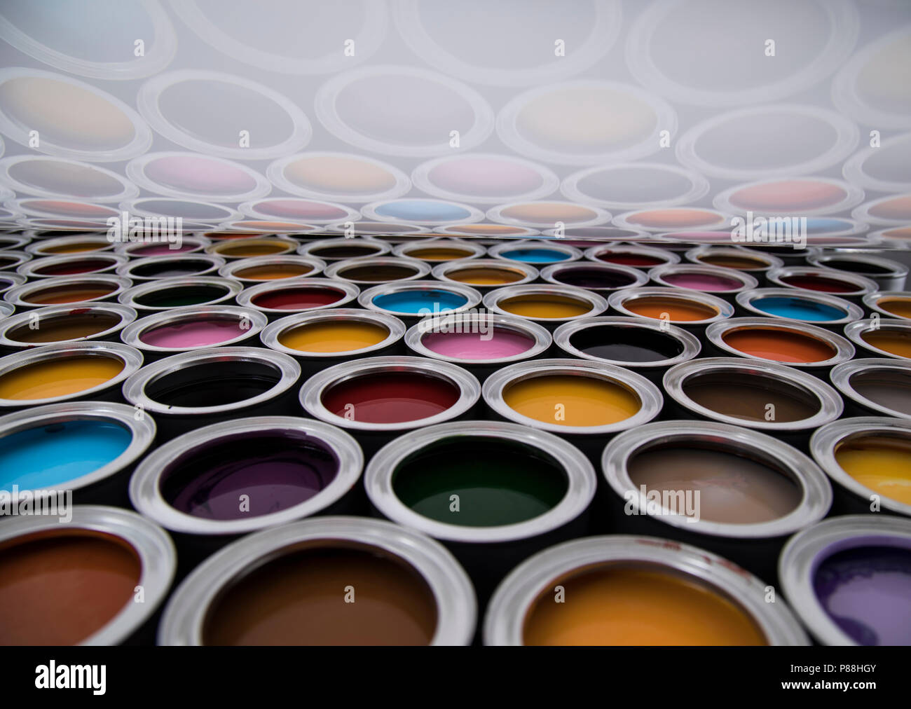 Group of tin metal cans with color paint Stock Photo - Alamy