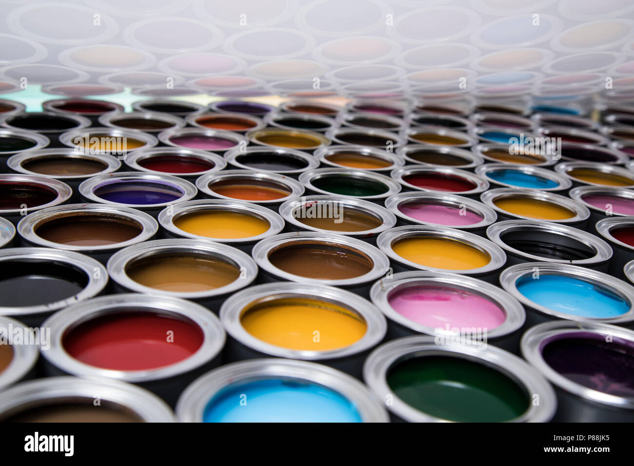 Full Buckets of rainbow colored oil paint Stock Photo - Alamy