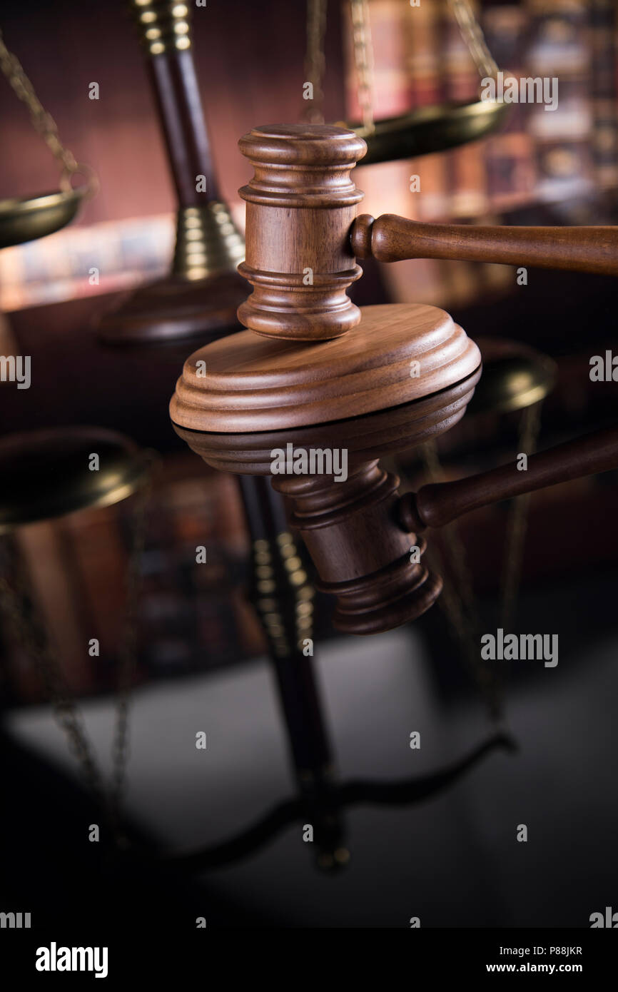 Law theme, mallet of judge, wooden gavel, mirror reflection background ...
