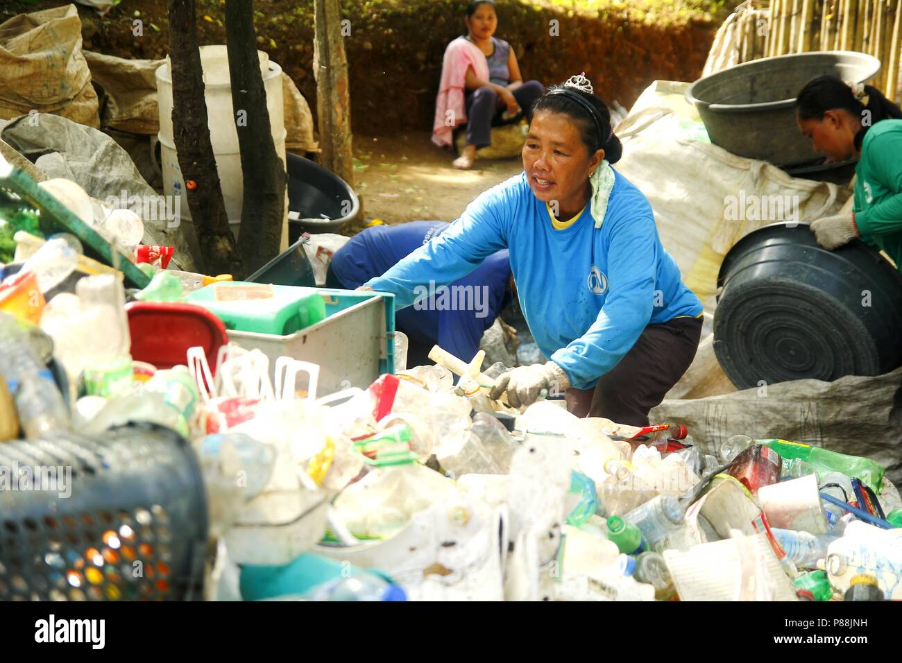 ANGONO, RIZAL, PHILIPPINES - JULY 4 2018: Workers of a materials ...
