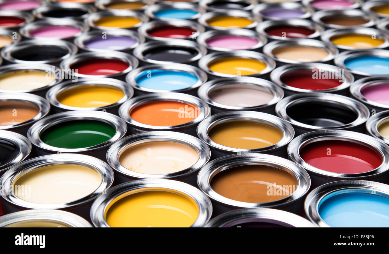 Group of tin metal cans with color paint Stock Photo - Alamy