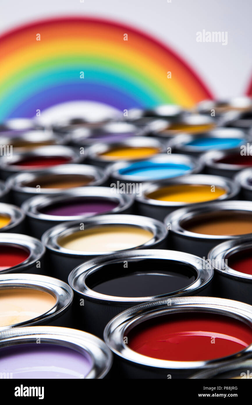 Rainbow colors, Open cans of paint Stock Photo - Alamy