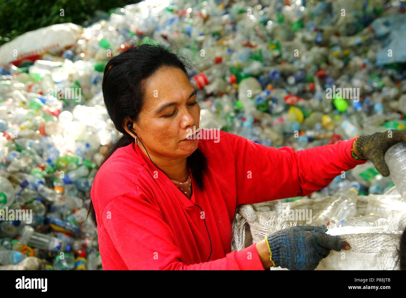 ANGONO, RIZAL, PHILIPPINES - JULY 4 2018: Workers of a materials ...