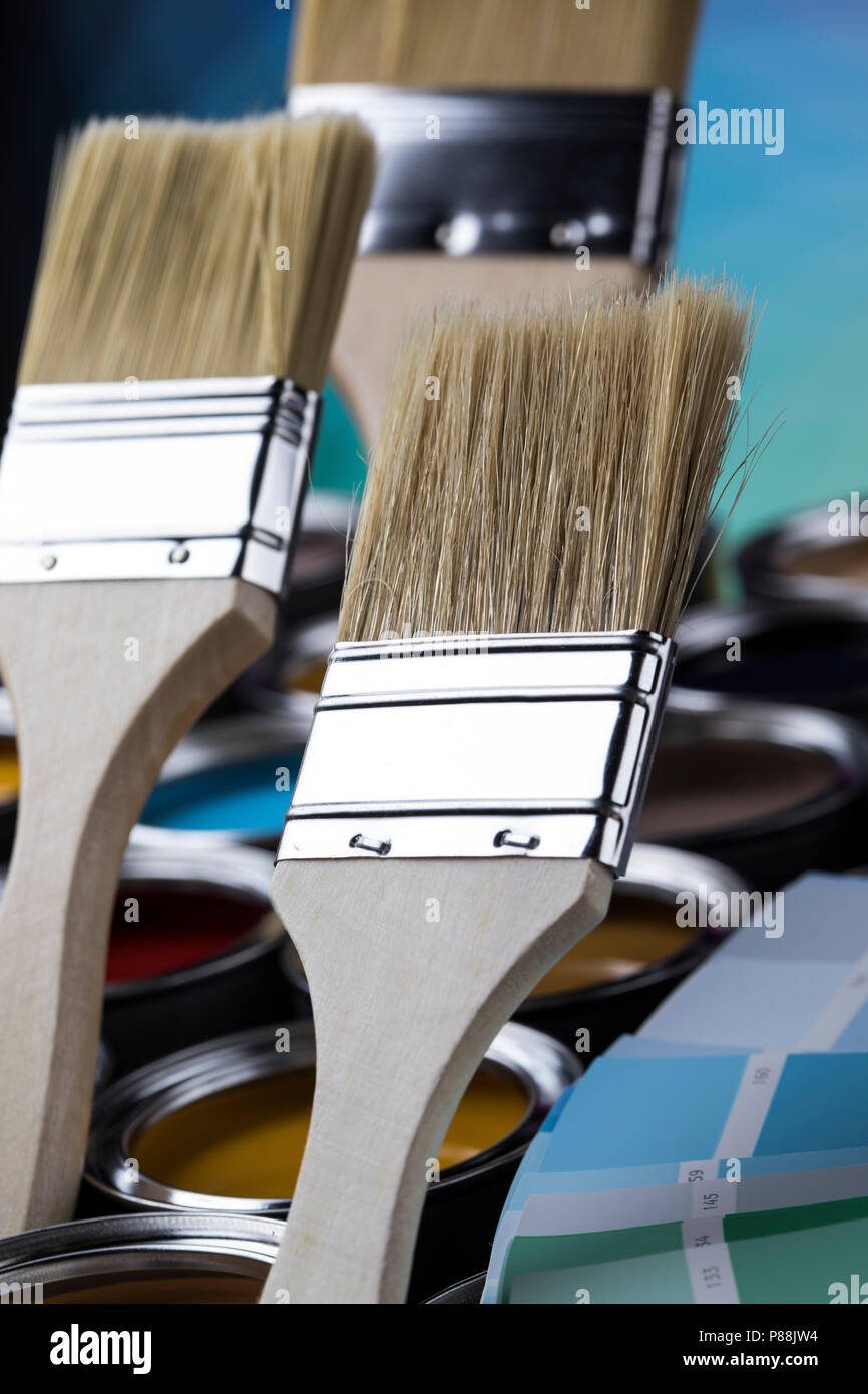 Tin cans with paint, brushes and bright palette of colors Stock Photo ...