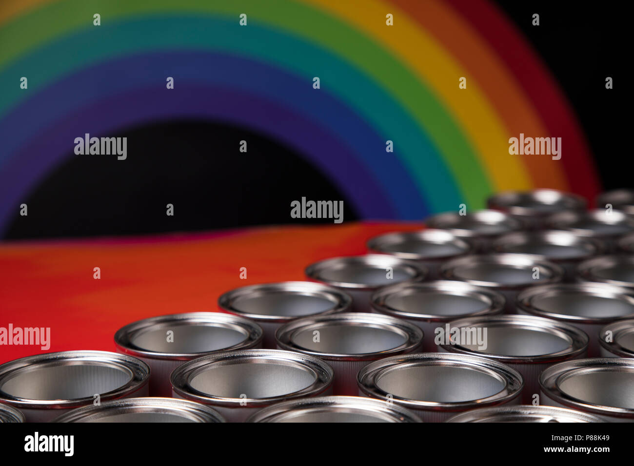 Rainbow, tin metal cans with color paint Stock Photo - Alamy