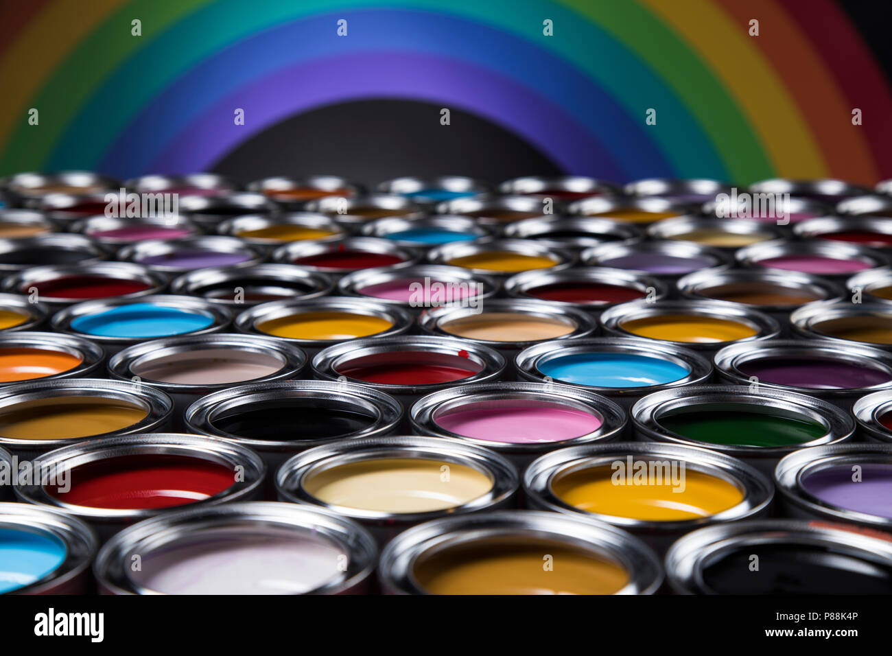 Rainbow, tin metal cans with color paint Stock Photo - Alamy