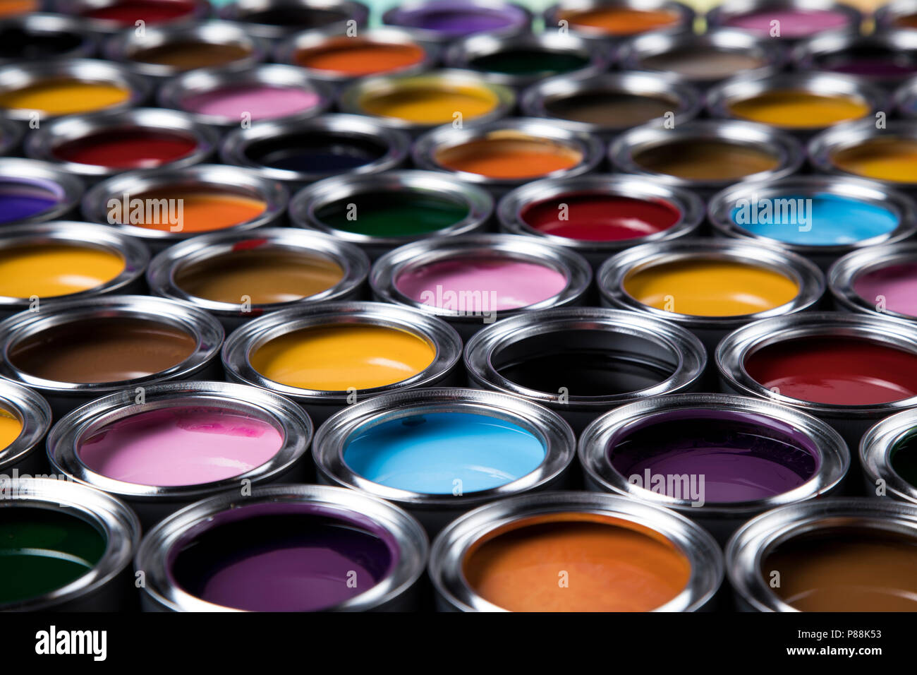Full Buckets of rainbow colored oil paint Stock Photo - Alamy