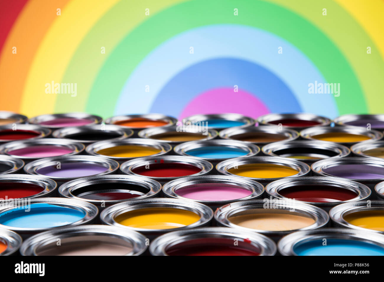 Rainbow, tin metal cans with color paint Stock Photo - Alamy